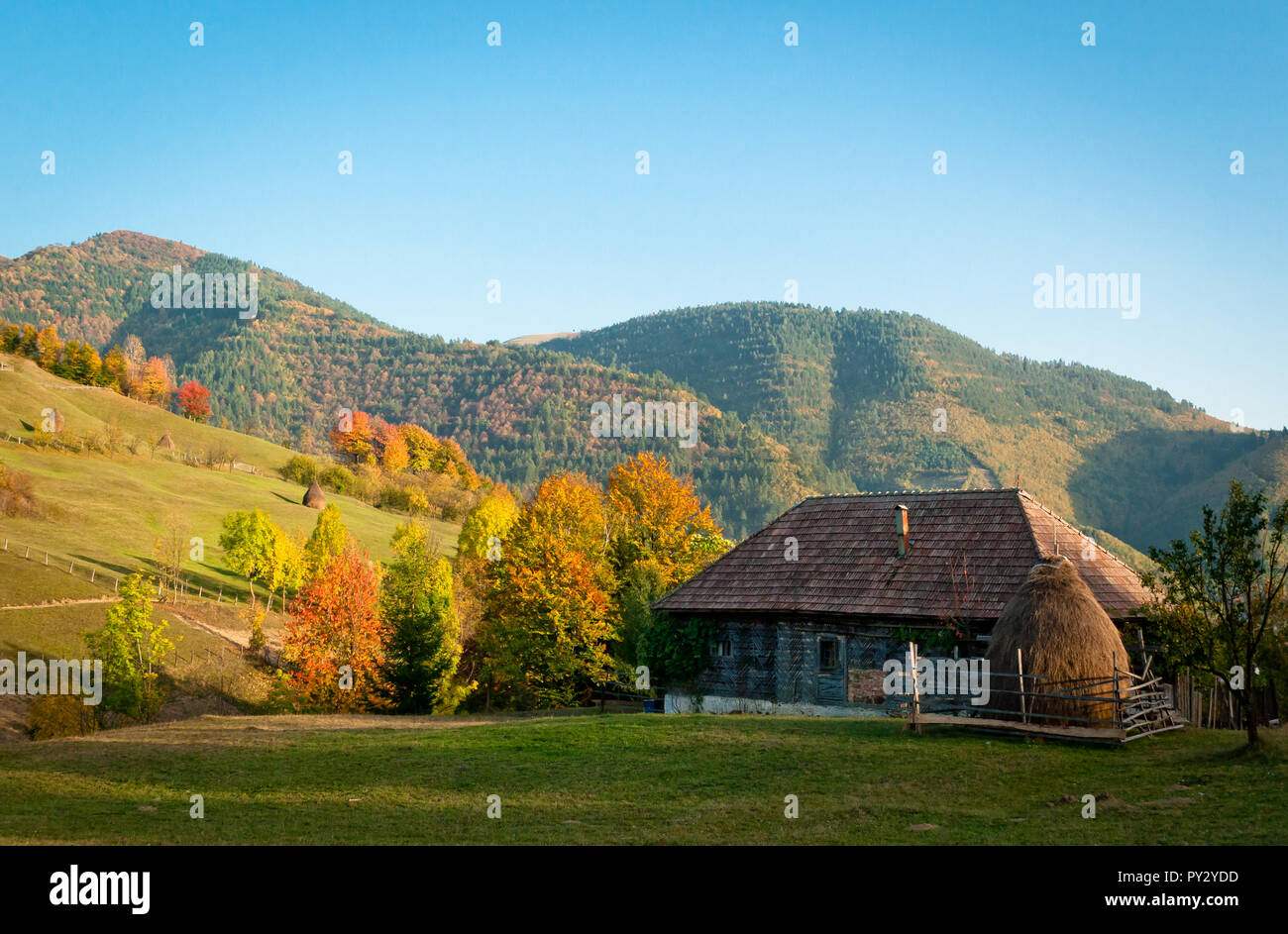 An old house in a very beautiful autumn rural landscape Stock Photo - Alamy