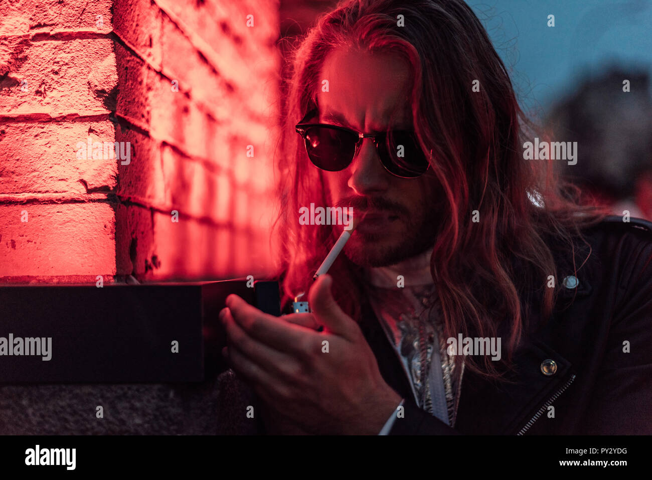 Leather jacket smoking cigarette hi-res stock photography and images ...
