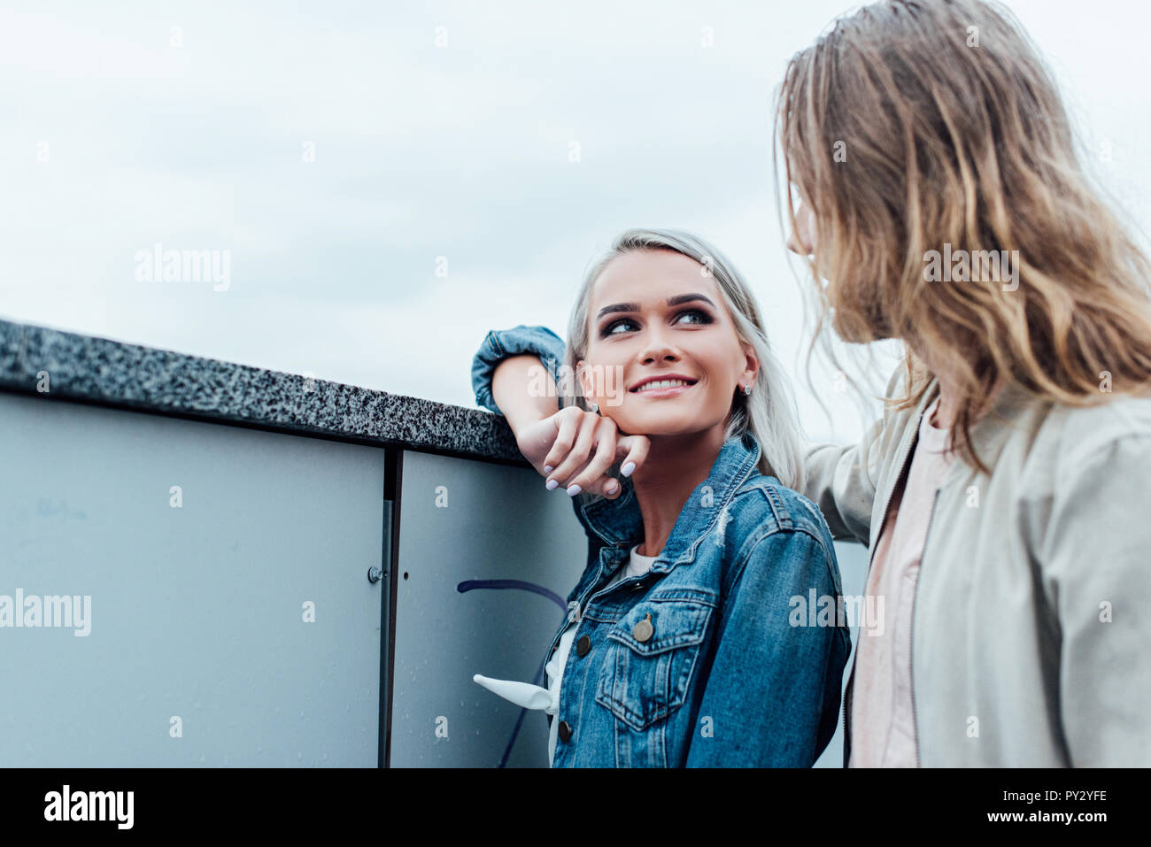 beautiful young couple flirting on city street Stock Photo - Alamy