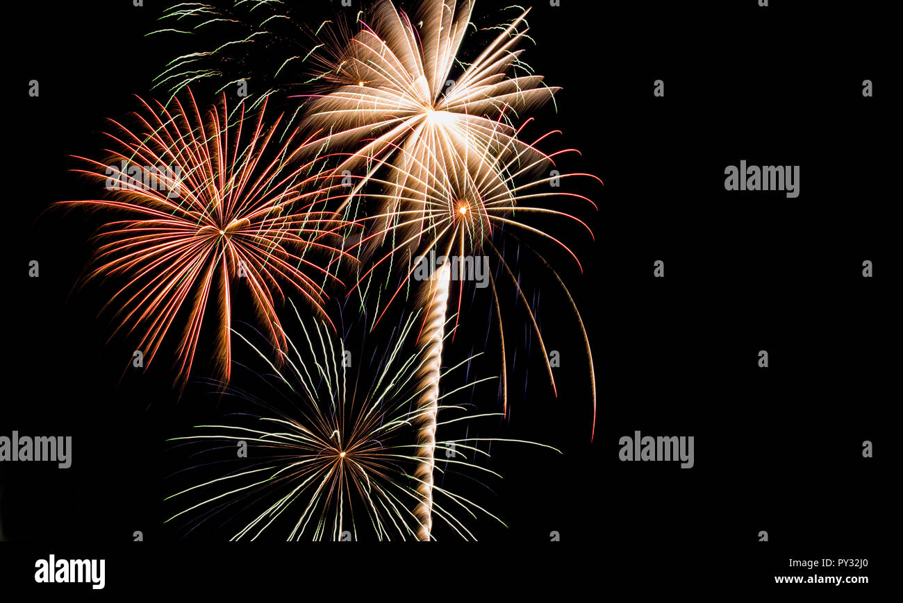 fireworks of different colors on black background Stock Photo - Alamy