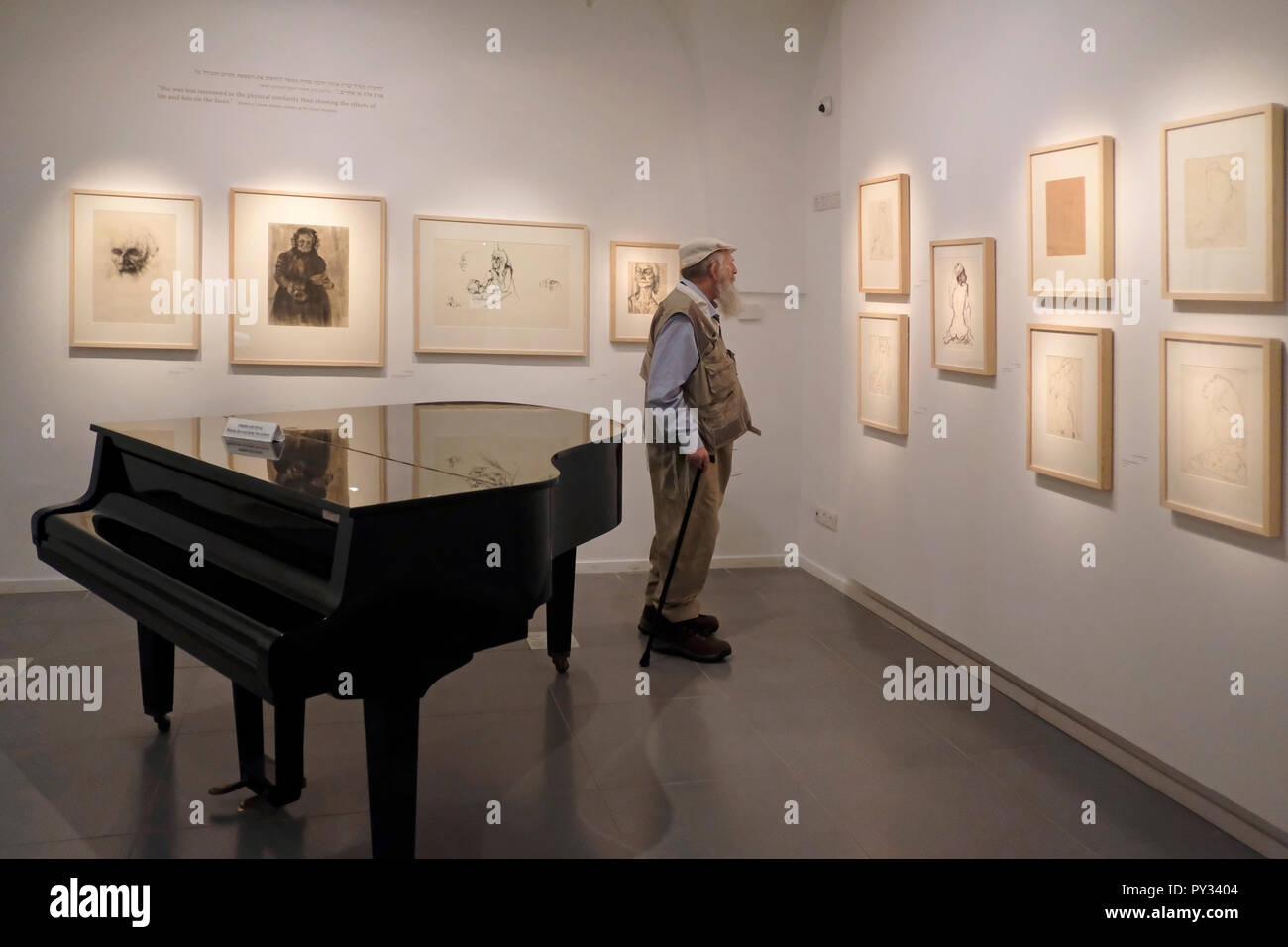 An elderly visitor looking at Anna Ticho's works displayed inside Anna ...