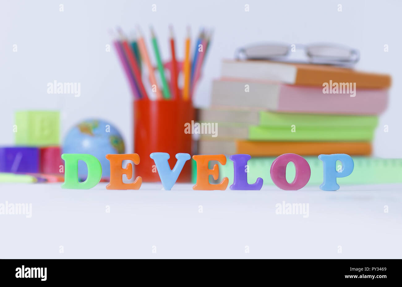 word develop on blurred background of school supplies .photo wit Stock ...