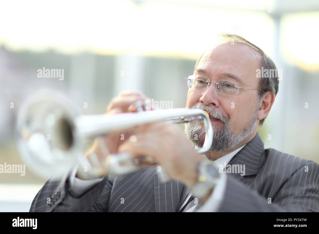 Portrait of a musician playing the trumpet Stock Photo - Alamy