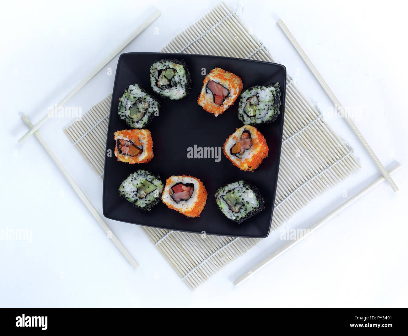 different types of Maki sushi on a black plate Stock Photo - Alamy