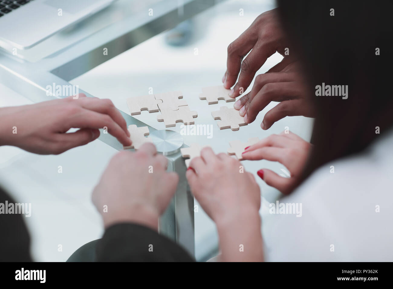 close up. business team assembling puzzle pieces Stock Photo - Alamy close up. business team assembling puzzle pieces Stock Photo - Alamy
