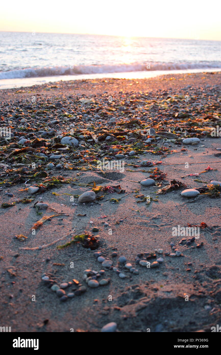 believe message on beach shore Stock Photo - Alamy