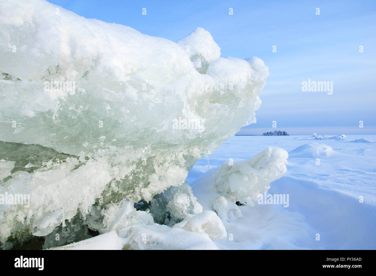 Winter landscape. Frozen lake with cracking ice Stock Photo - Alamy