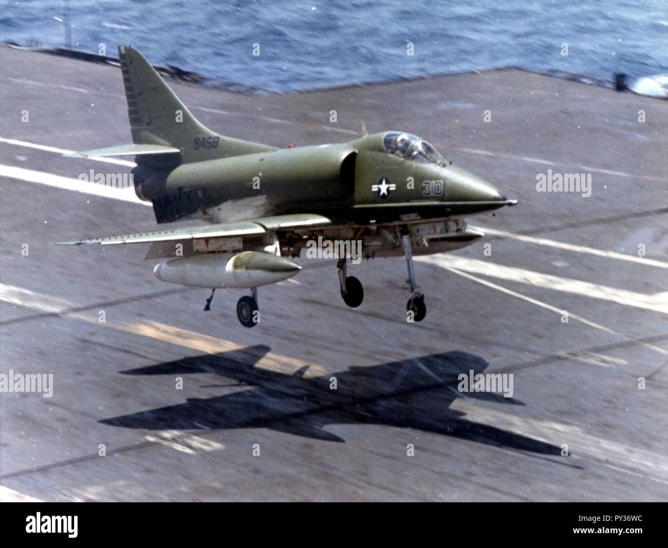 Camouflaged A-4C of VA-113 landing on USS Kitty Hawk (CVA-63) c1966 ...