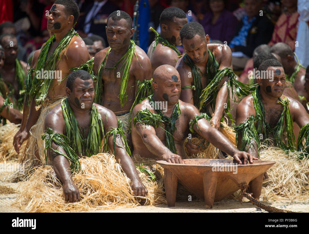 Men in traditional dress at the unveiling of a statue commemorating ...