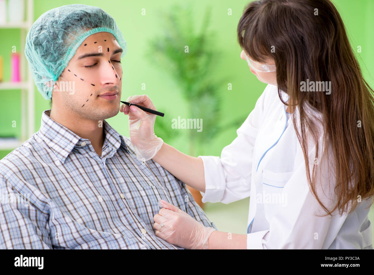 Plastic surgeon preparing for operation on man face Stock Photo - Alamy