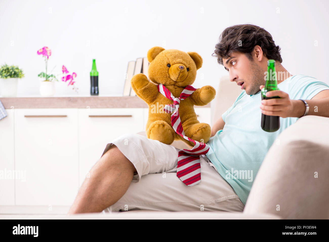 Young drunk handsome man after party at home Stock Photo - Alamy