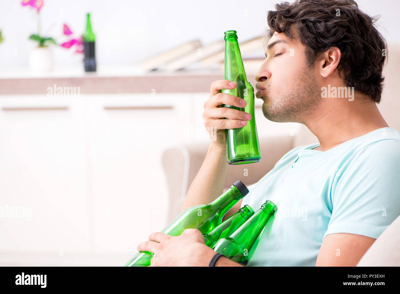 Young drunk handsome man after party at home Stock Photo - Alamy