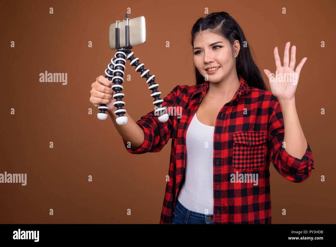 Young beautiful Asian woman vlogging with mobile phone Stock Photo - Alamy