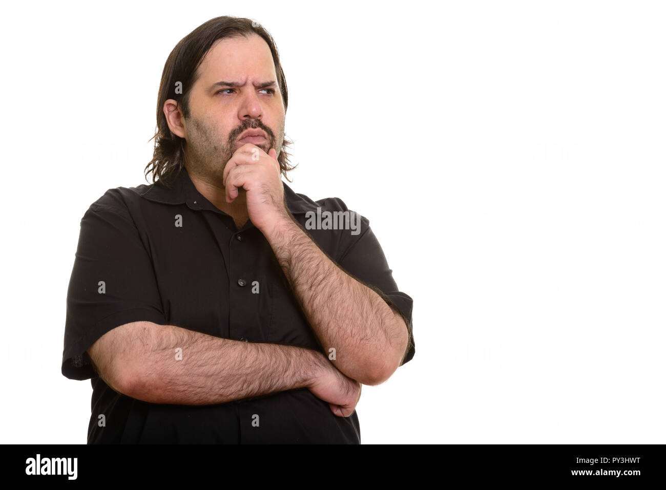 Fat serious Caucasian man thinking and looking up Stock Photo - Alamy