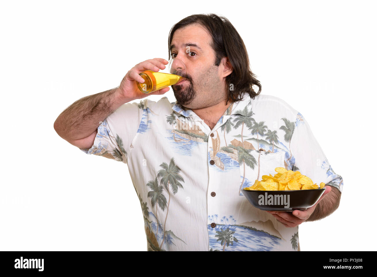 Fat Caucasian man drinking beer and holding bowl of chips ready Stock ...
