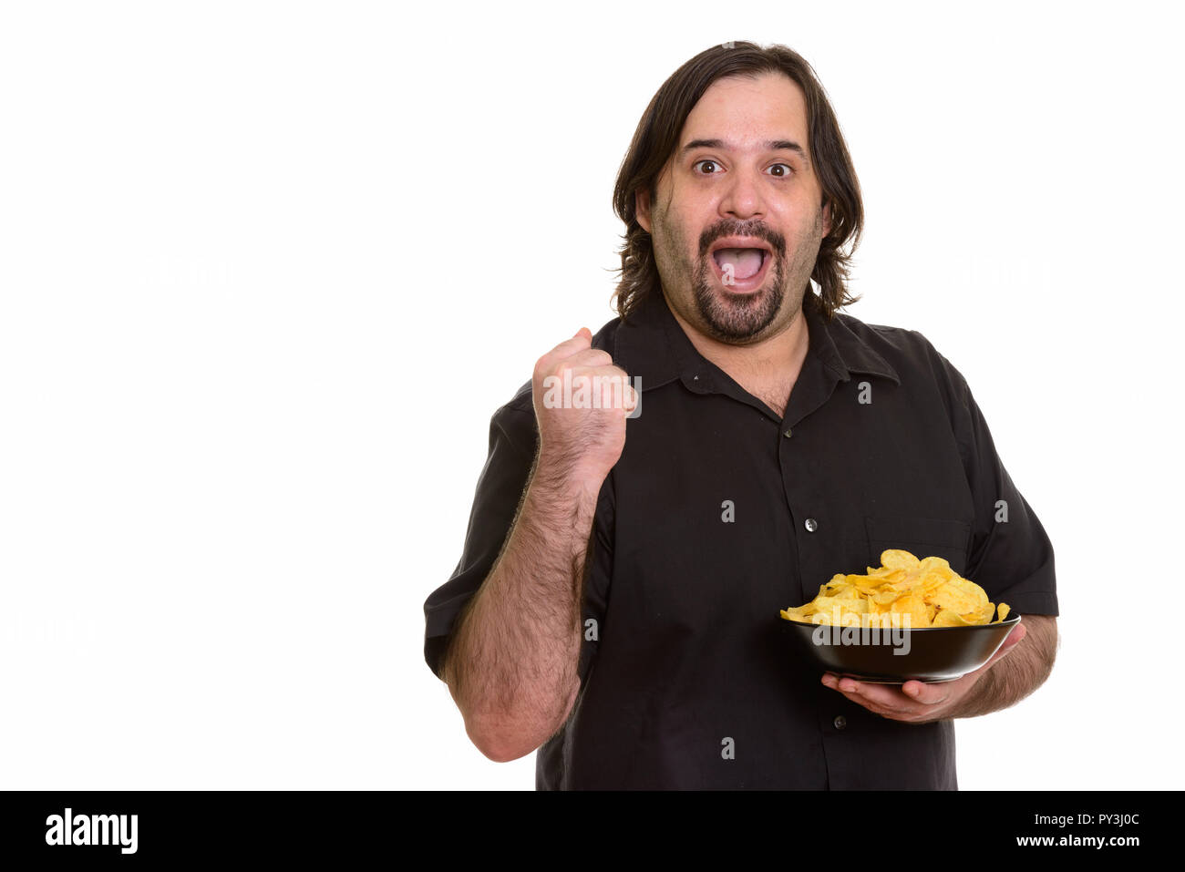 Happy fat Caucasian man smiling and looking motivated while hold Stock ...