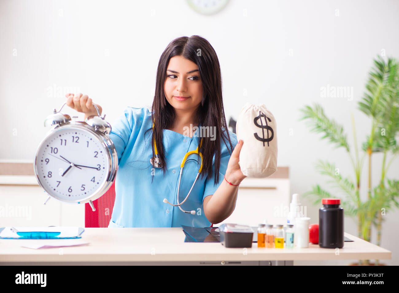 Young beautiful female doctor working in the clinic Stock Photo - Alamy