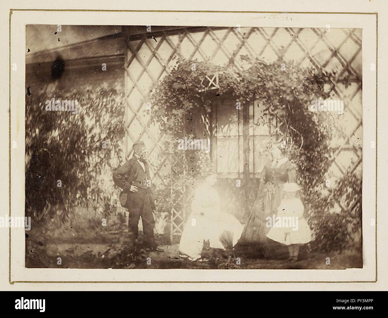 Calvert Richard Jones two women a girl and a dog in a leafy arbour ...