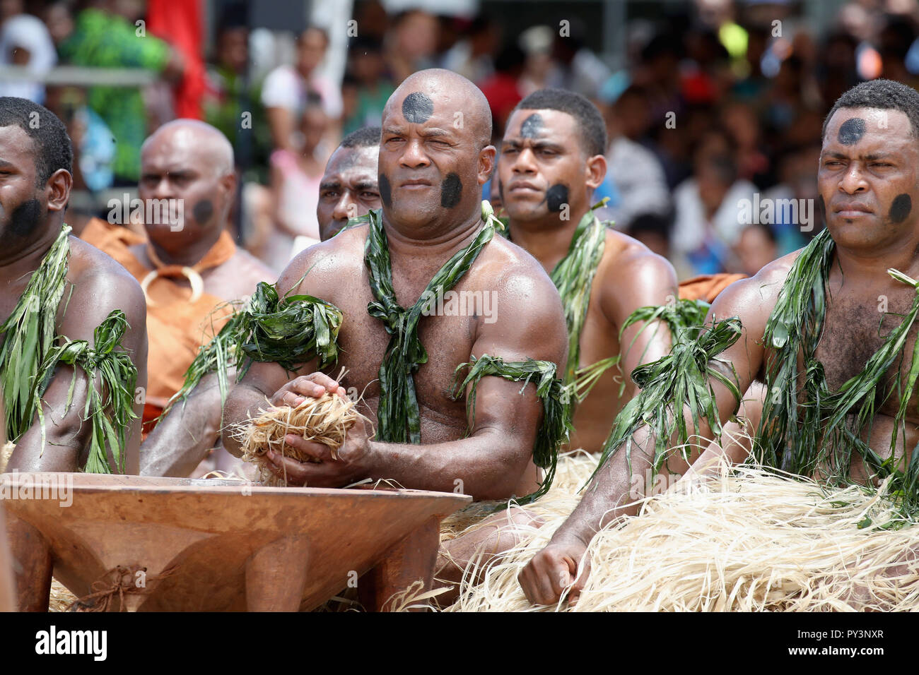 Locals in traditional dress attend the attend the unveiling of a statue ...