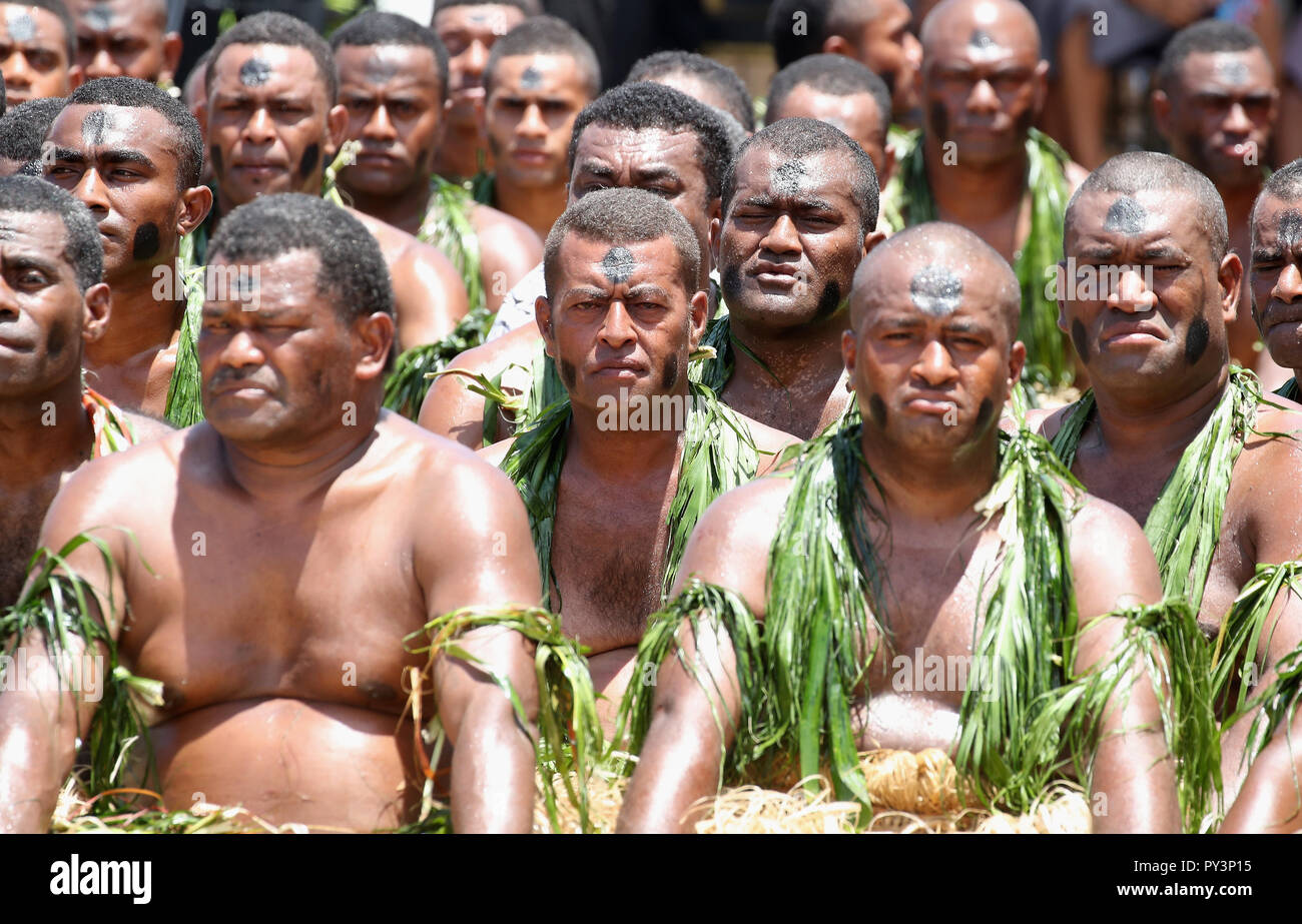 Locals in traditional dress attend the attend the unveiling of a statue ...