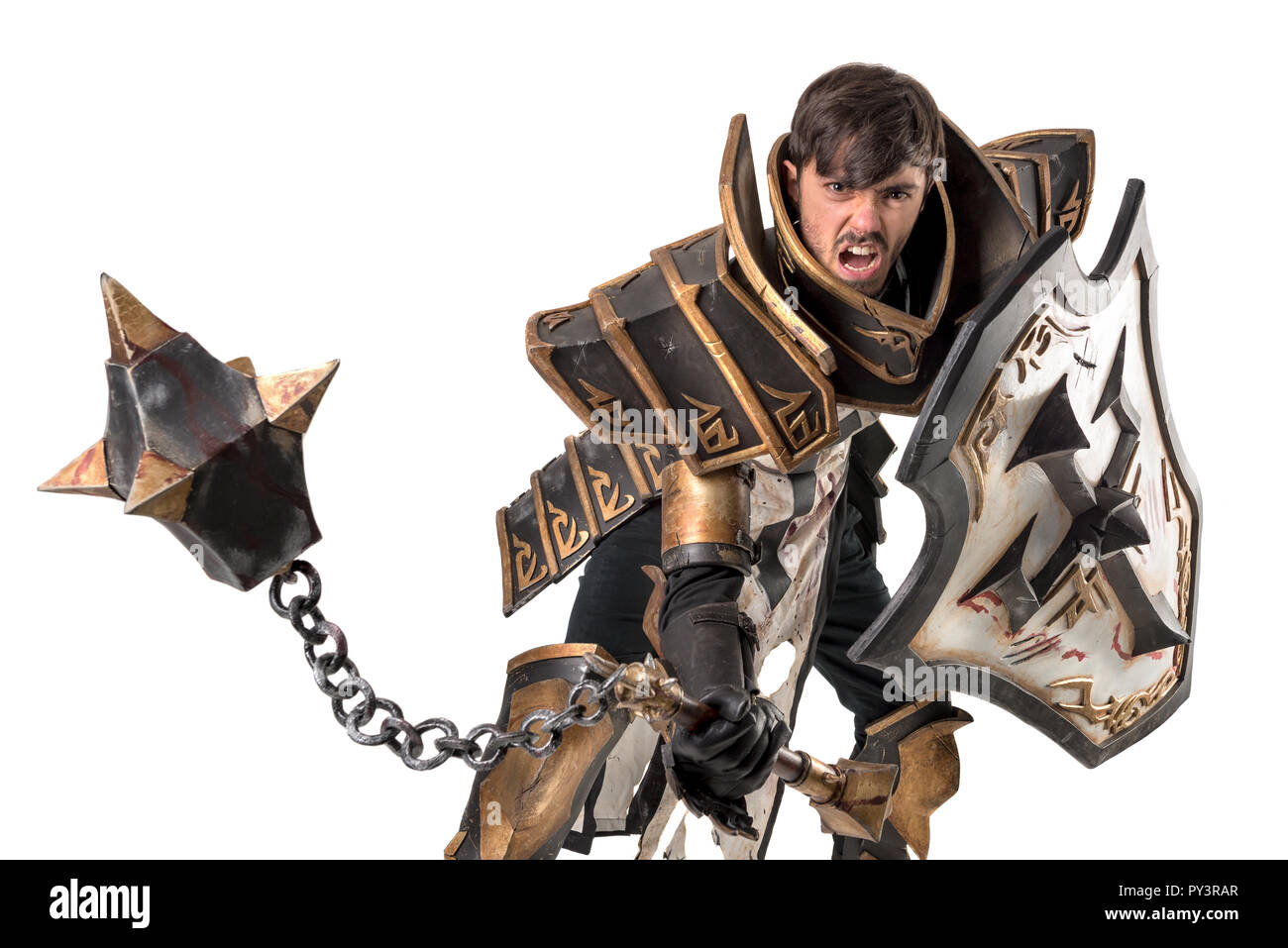 Young man cosplaying with fantasy knight costume Stock Photo - Alamy