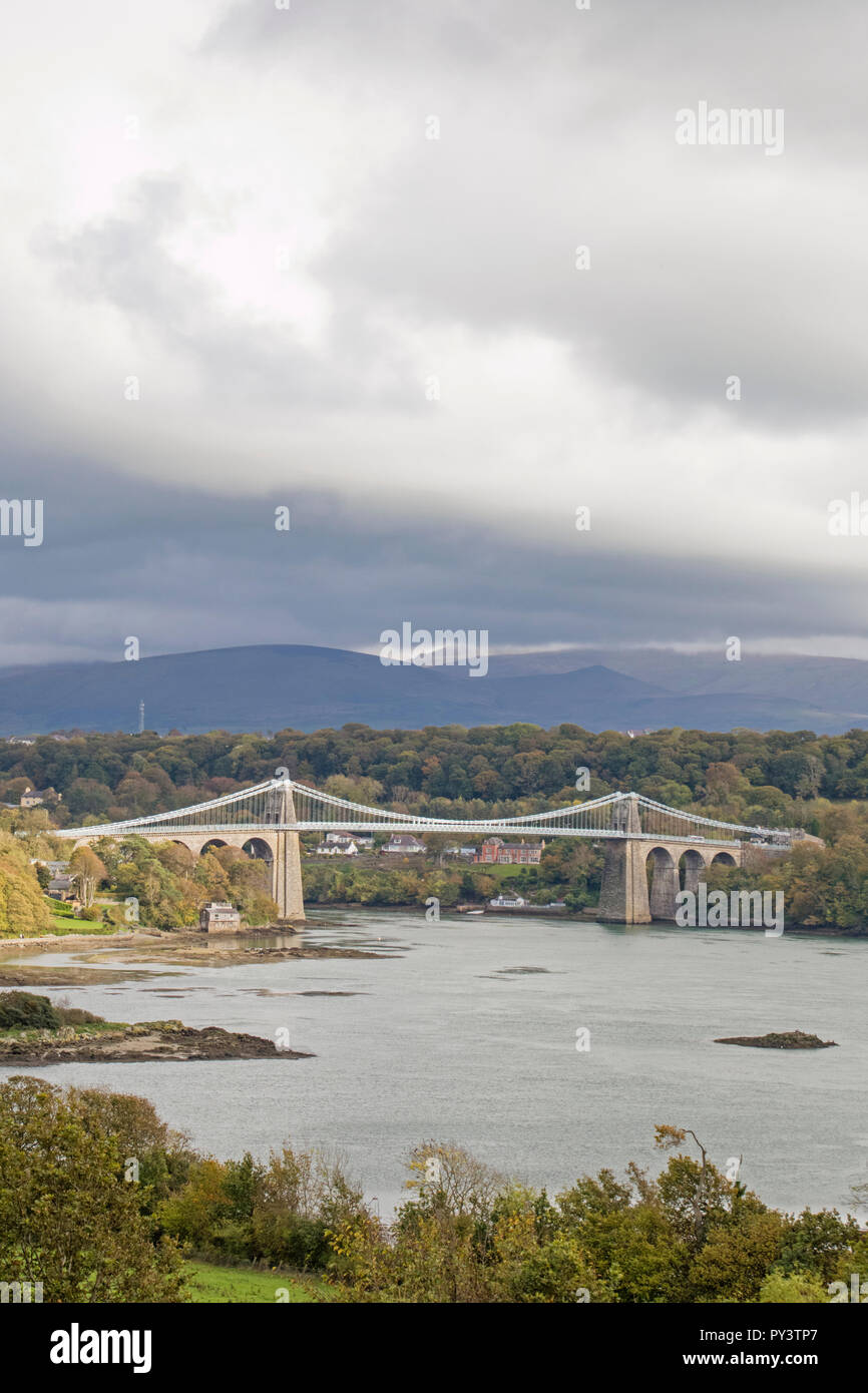 The Menai Suspension Bridge spanning the Menai Strait in autumn light ...
