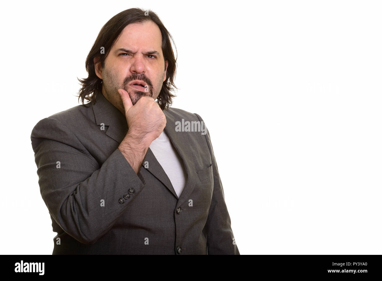 Portrait of fat Caucasian businessman thinking seriously Stock Photo ...