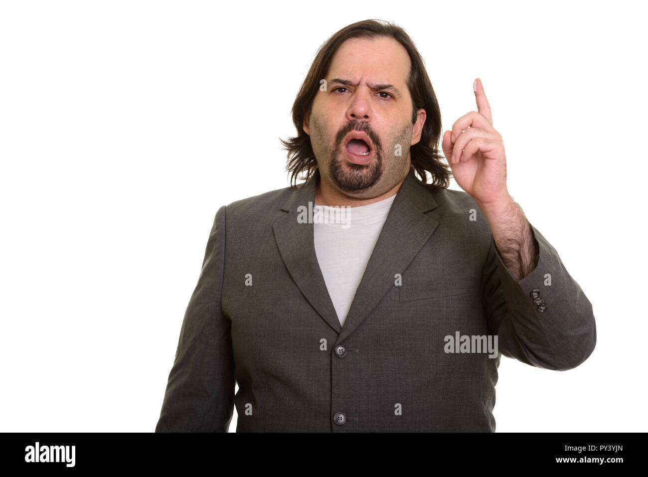 Fat Caucasian businessman looking angry and pointing finger up Stock ...