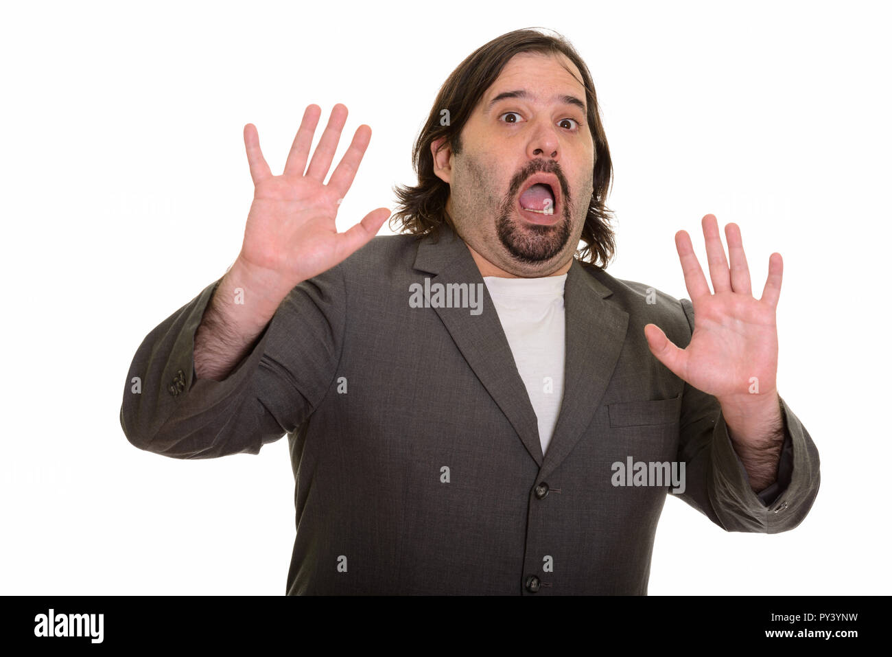 Fat Caucasian businessman looking guilty with arms raised Stock Photo ...