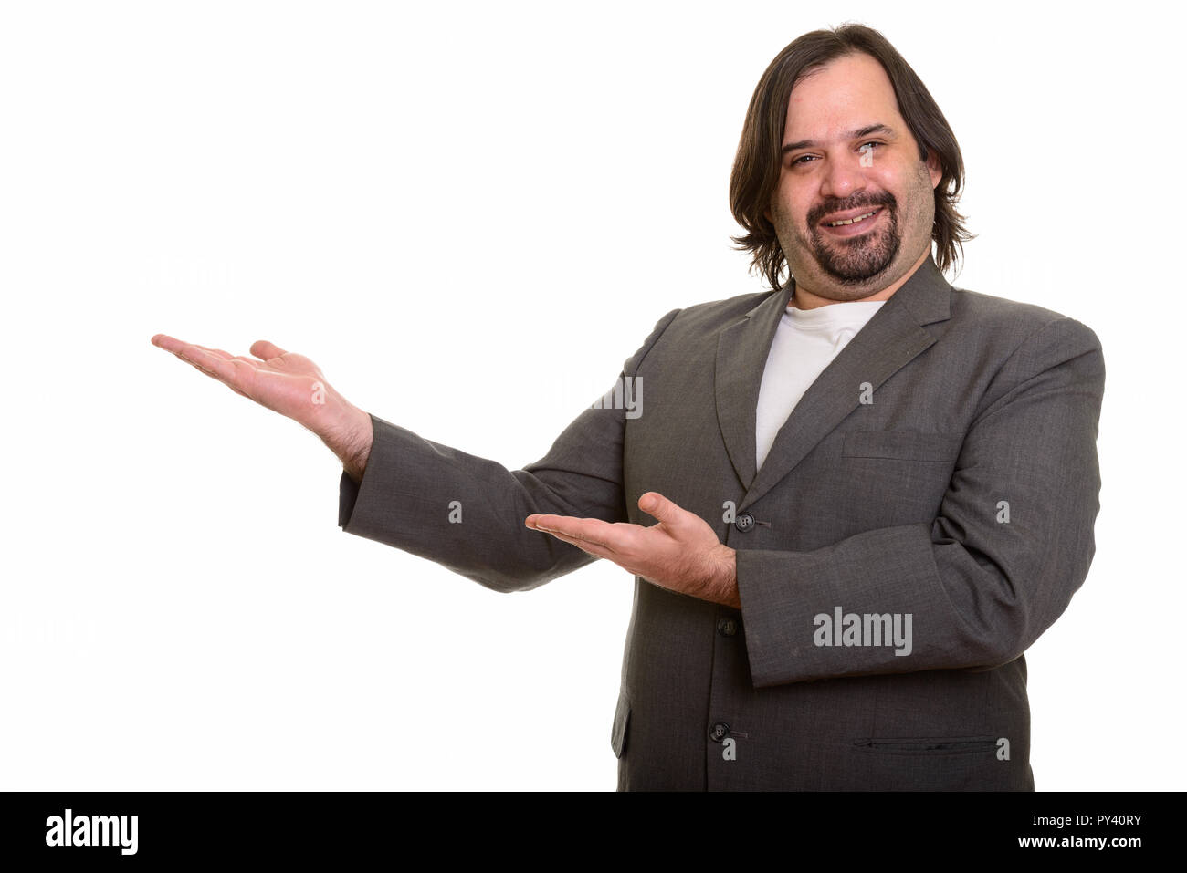 Happy fat Caucasian businessman smiling showing something Stock Photo ...