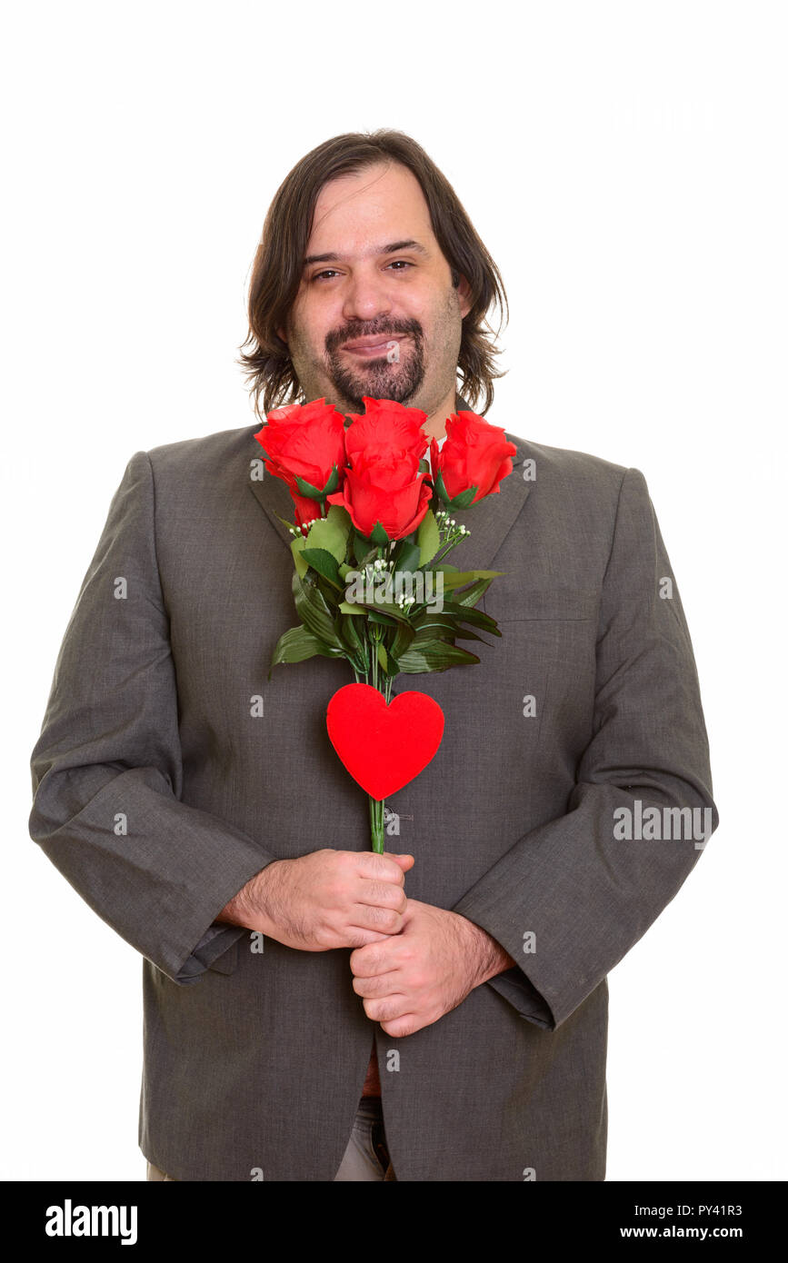 Happy fat Caucasian businessman smiling holding red roses and he Stock ...