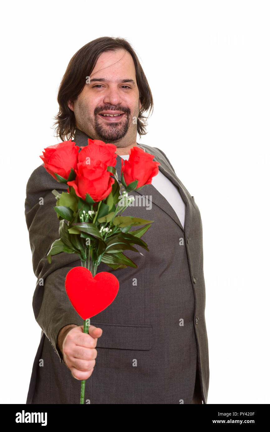 Happy fat Caucasian businessman smiling giving red roses and hea Stock ...