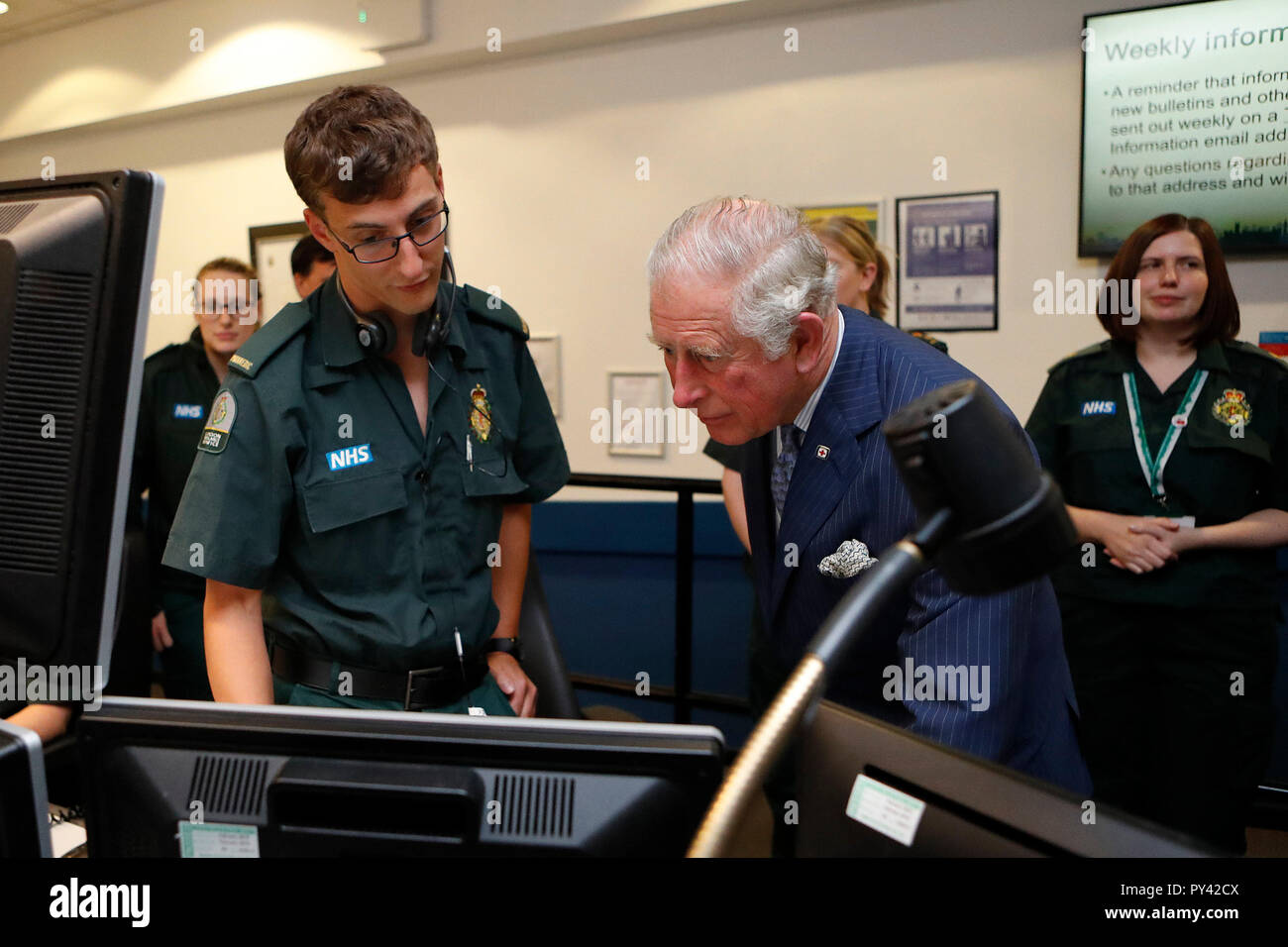 The Prince of Wales meets staff during a visit to the London Ambulance ...