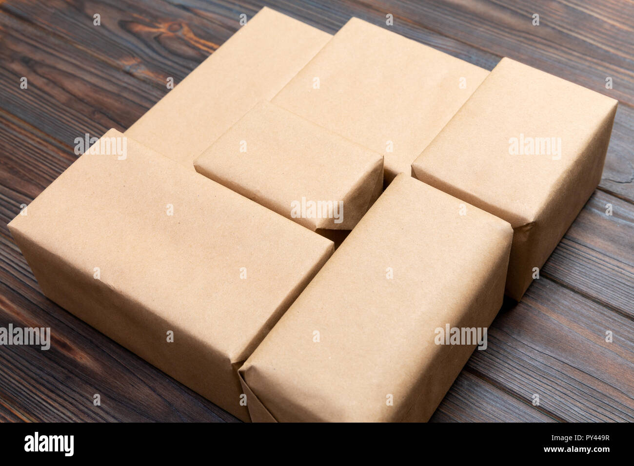 Brown mail package parcel blank for you design. Cardboard box on a dark ...