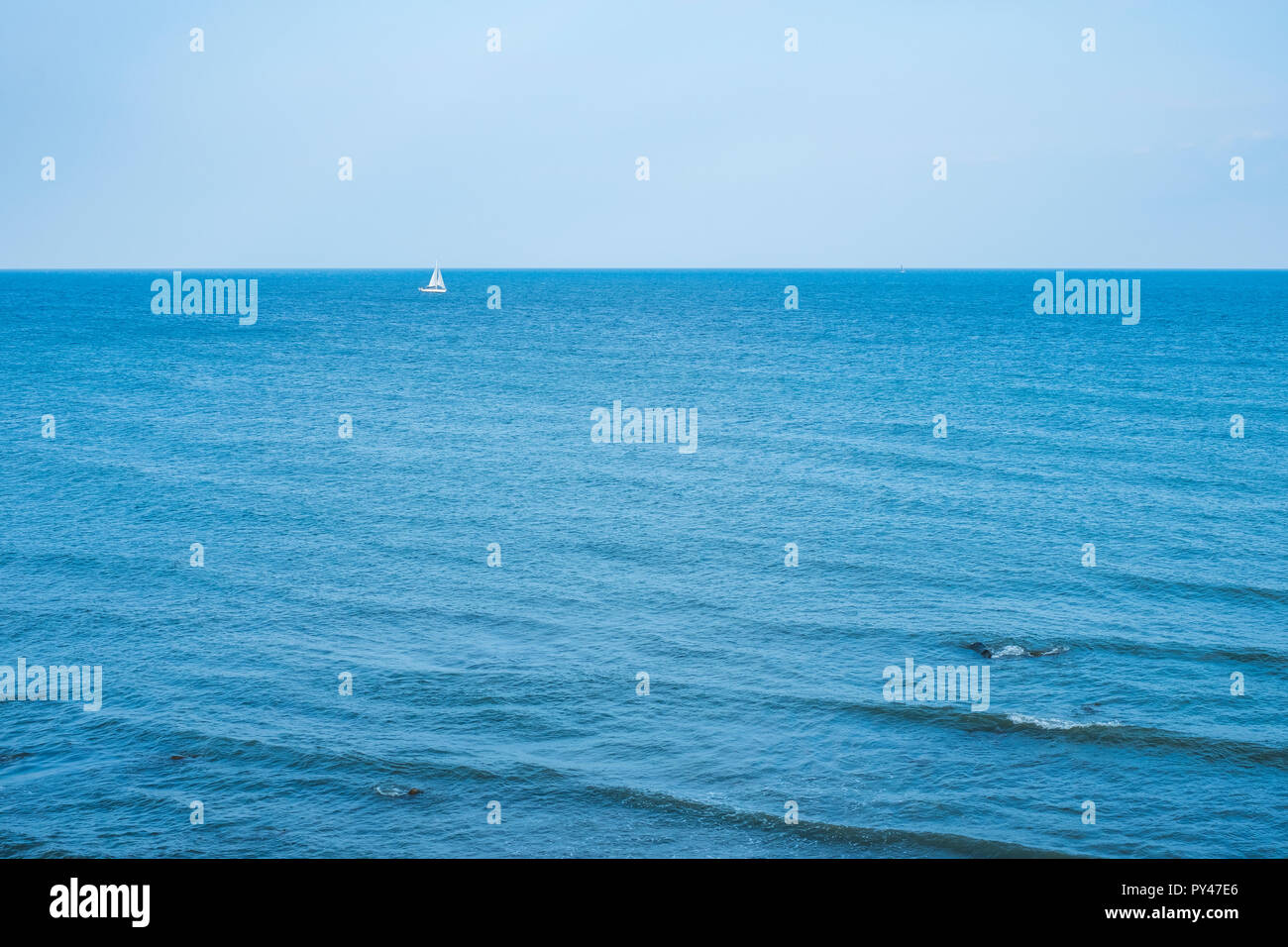 Distant sail boat hi-res stock photography and images - Alamy