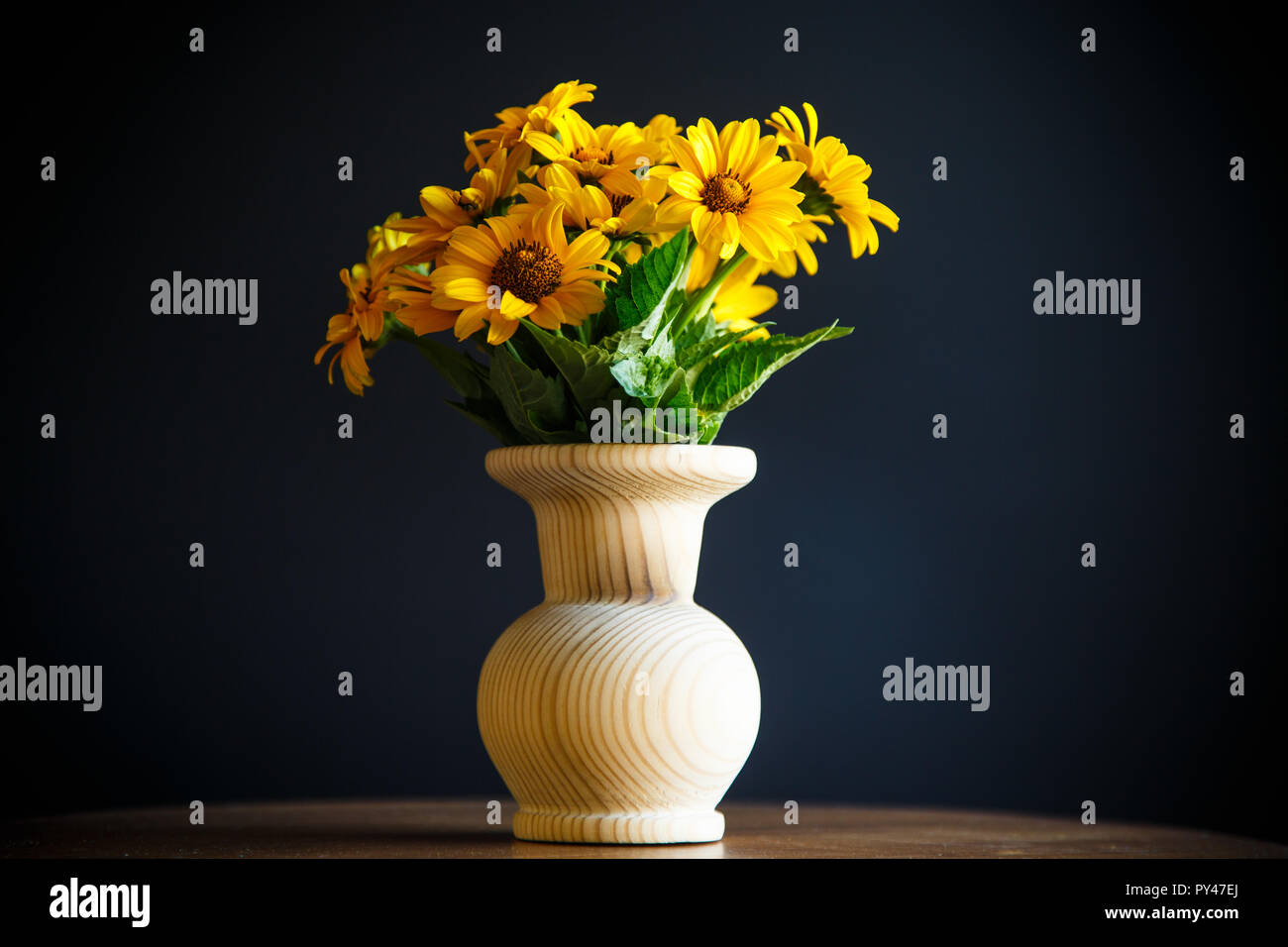 bouquet of yellow big daisies on a black background Stock Photo - Alamy