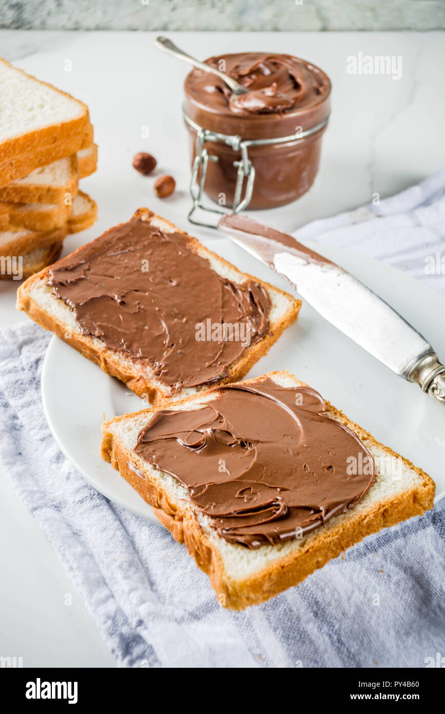 Chocolate and hazelnut spread sandwiches with white toasted bread ...