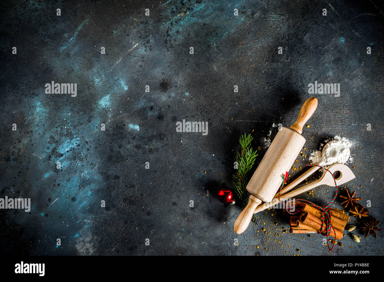Christmas bakery background, with baking utensils, flour, spices and ...