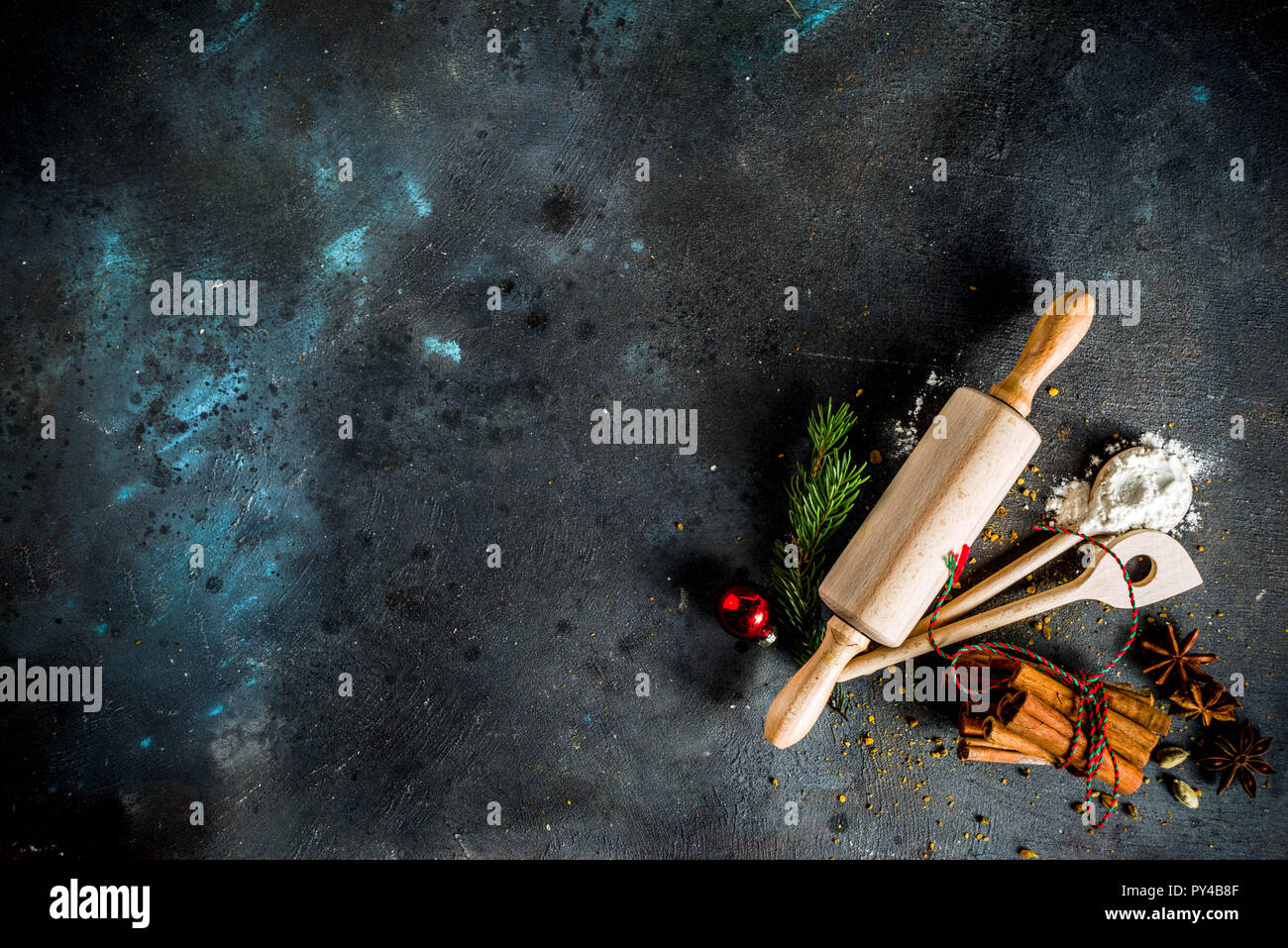 Christmas bakery background, with baking utensils, flour, spices and ...