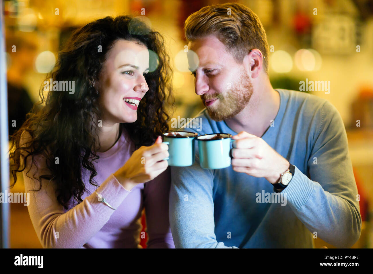 Romantic couple having date in coffee shop Stock Photo - Alamy