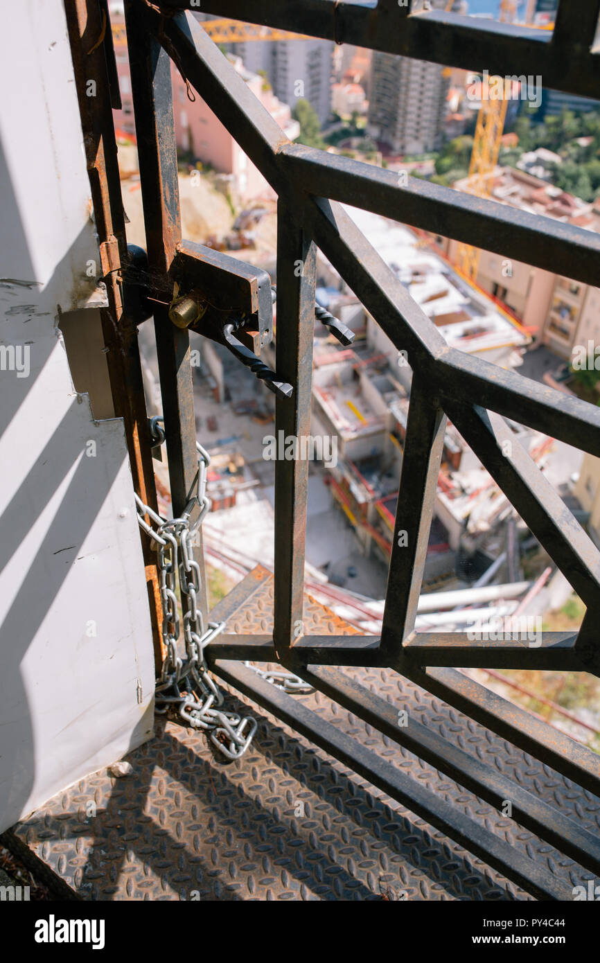 Iron gate Iron gate with a view of the cliff building and the city in ...