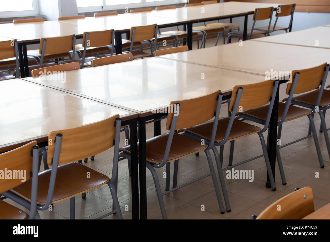Interior view of an empty school canteen with tables and chairs Stock ...