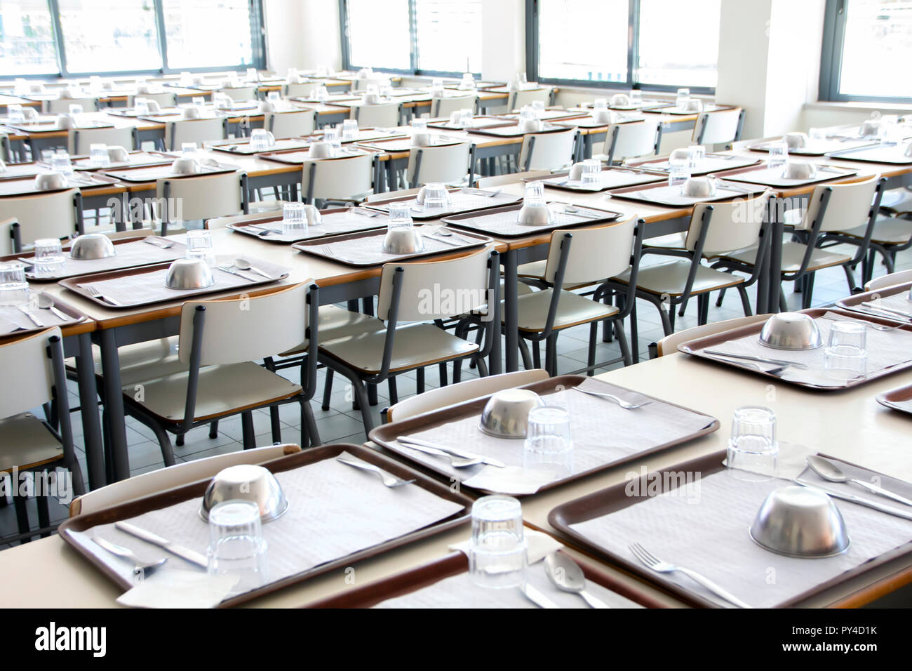 Interior view of an empty school canteen with tables and chairs Stock ...