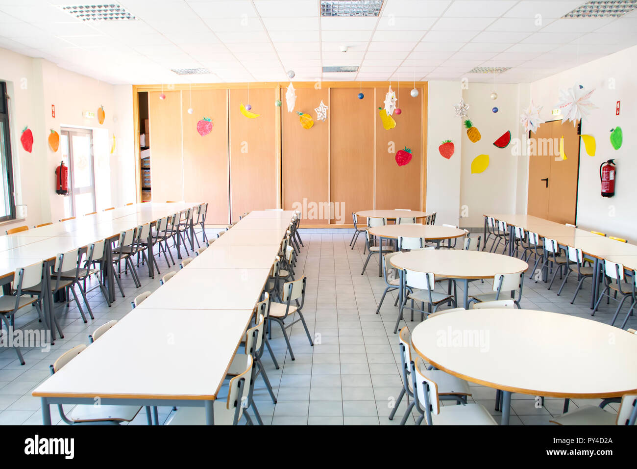 Interior view of an empty school canteen with tables and chairs Stock ...