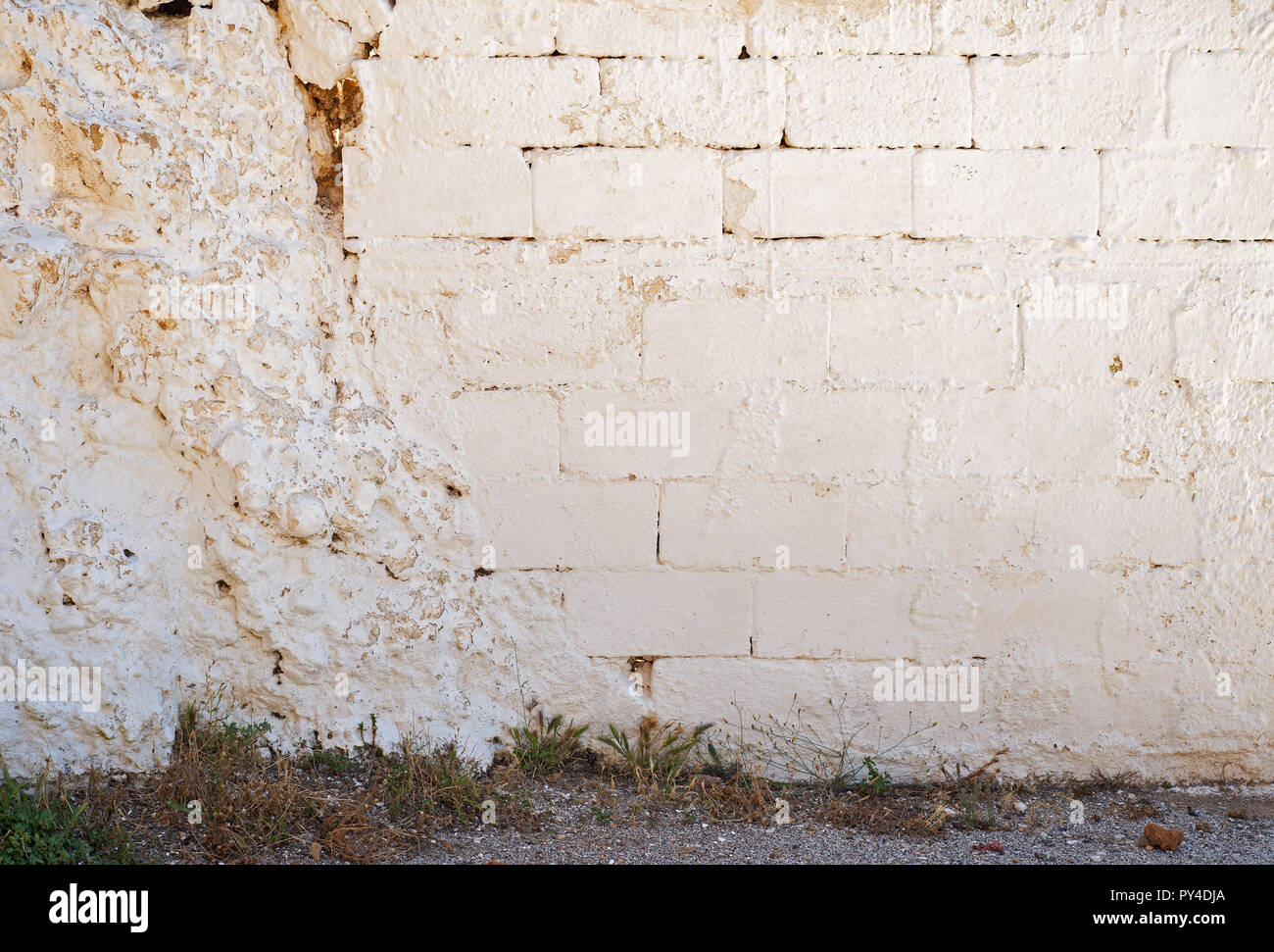 Part of abandoned white brick cracked stucco wall Stock Photo - Alamy