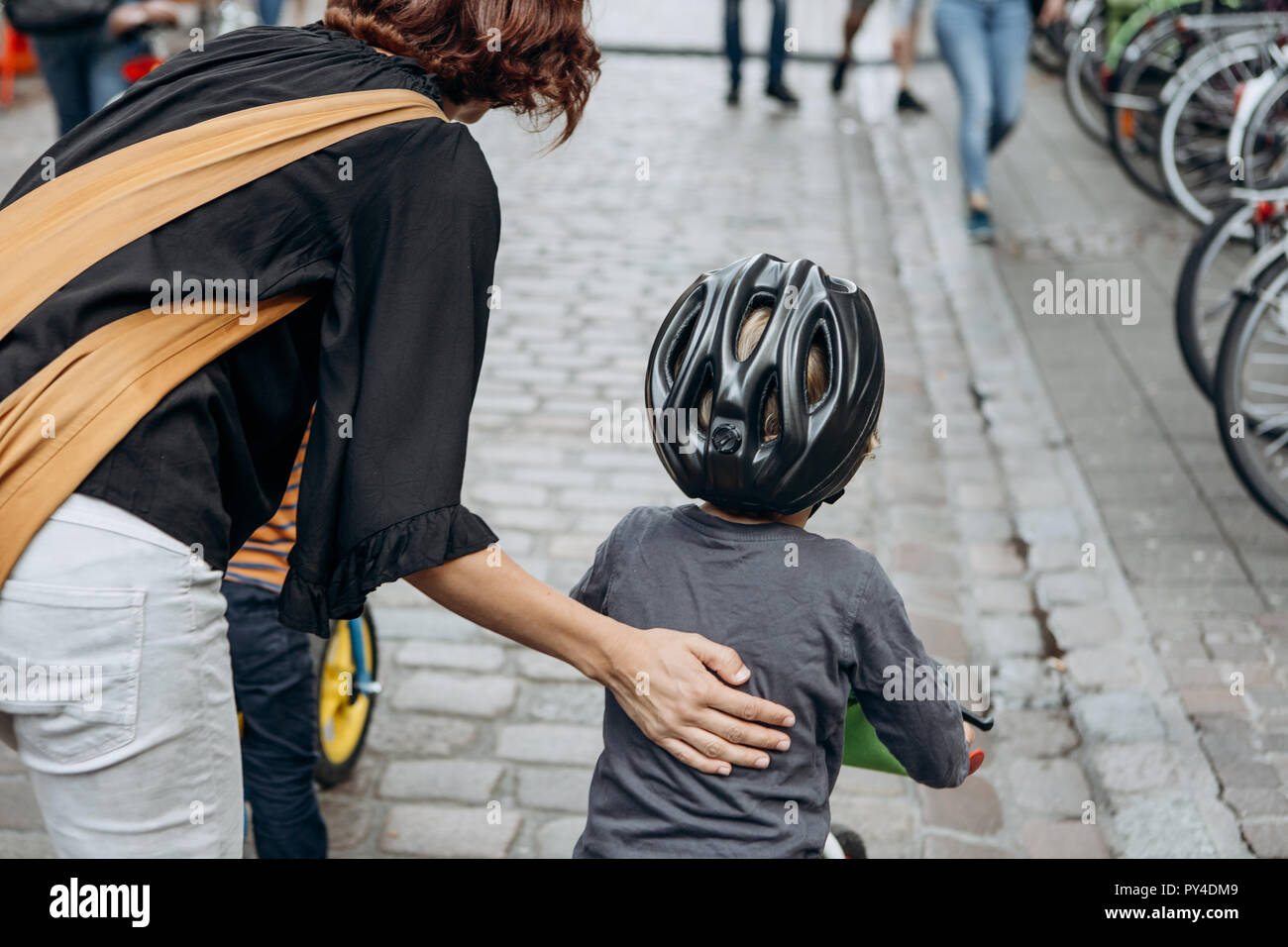 Family son teaches cycle hi-res stock photography and images - Alamy
