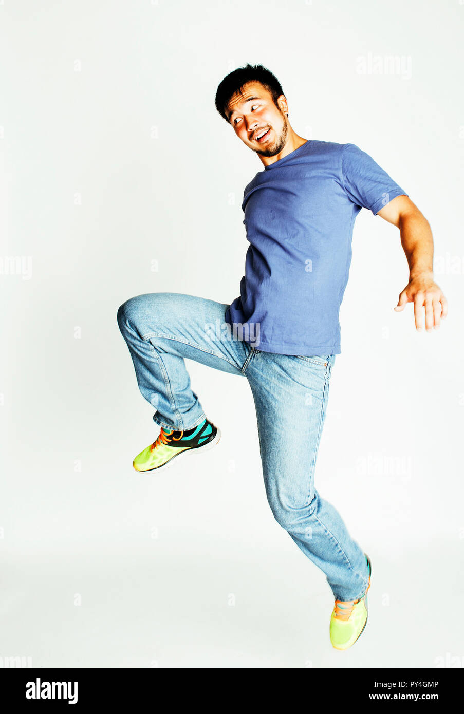 young pretty asian man jumping cheerful against white background Stock ...