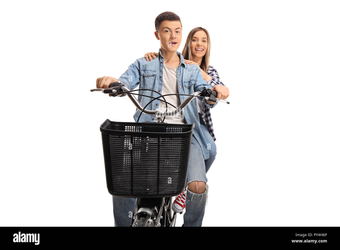 Smiling boy and girl riding on the same bike isolated on white ...
