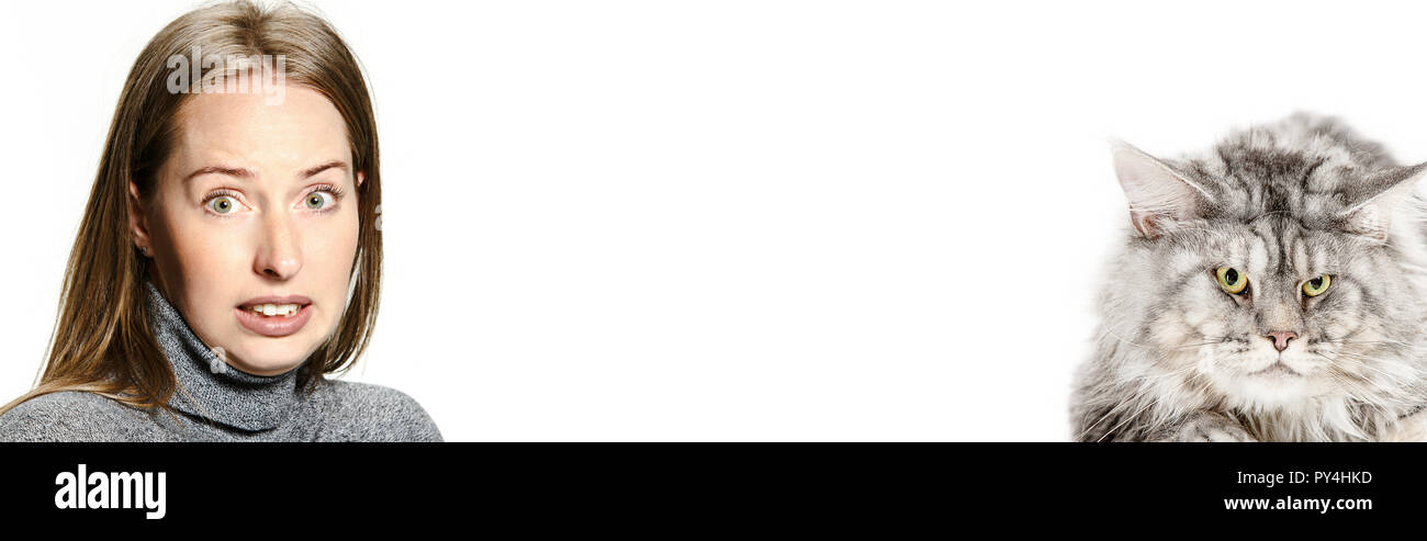 The surprised and indignant woman and her cat over white background at ...