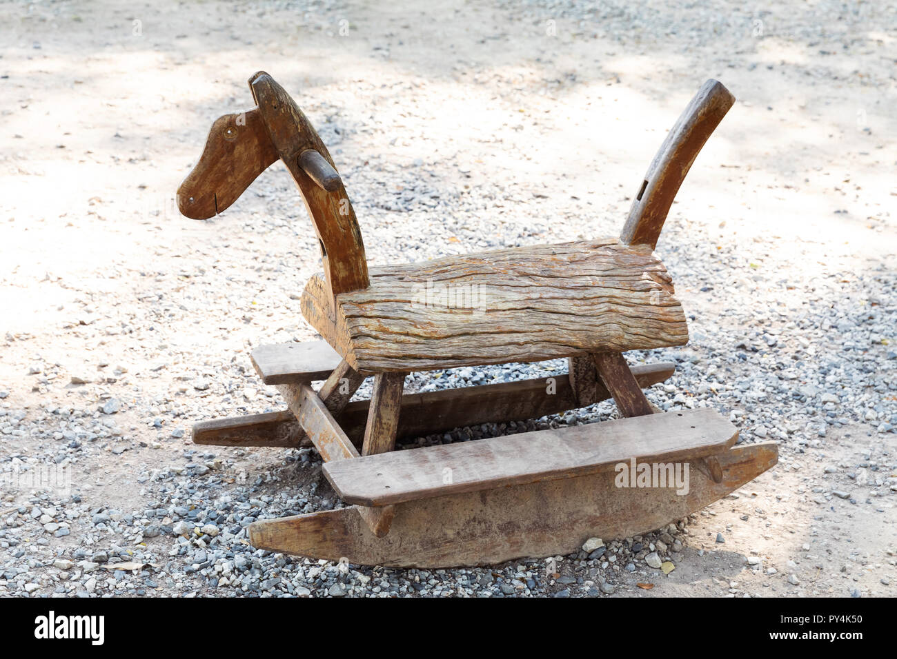 Old and weathered wooden rocking horse in park Stock Photo - Alamy